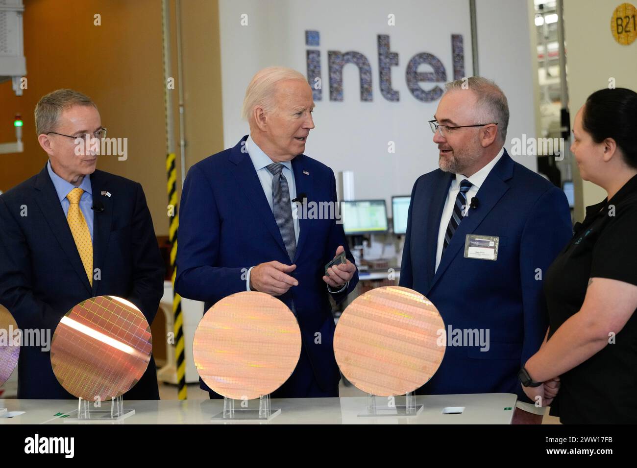 President Joe Biden listens to Intel CEO Pat Gelsinger, left, as Intel ...