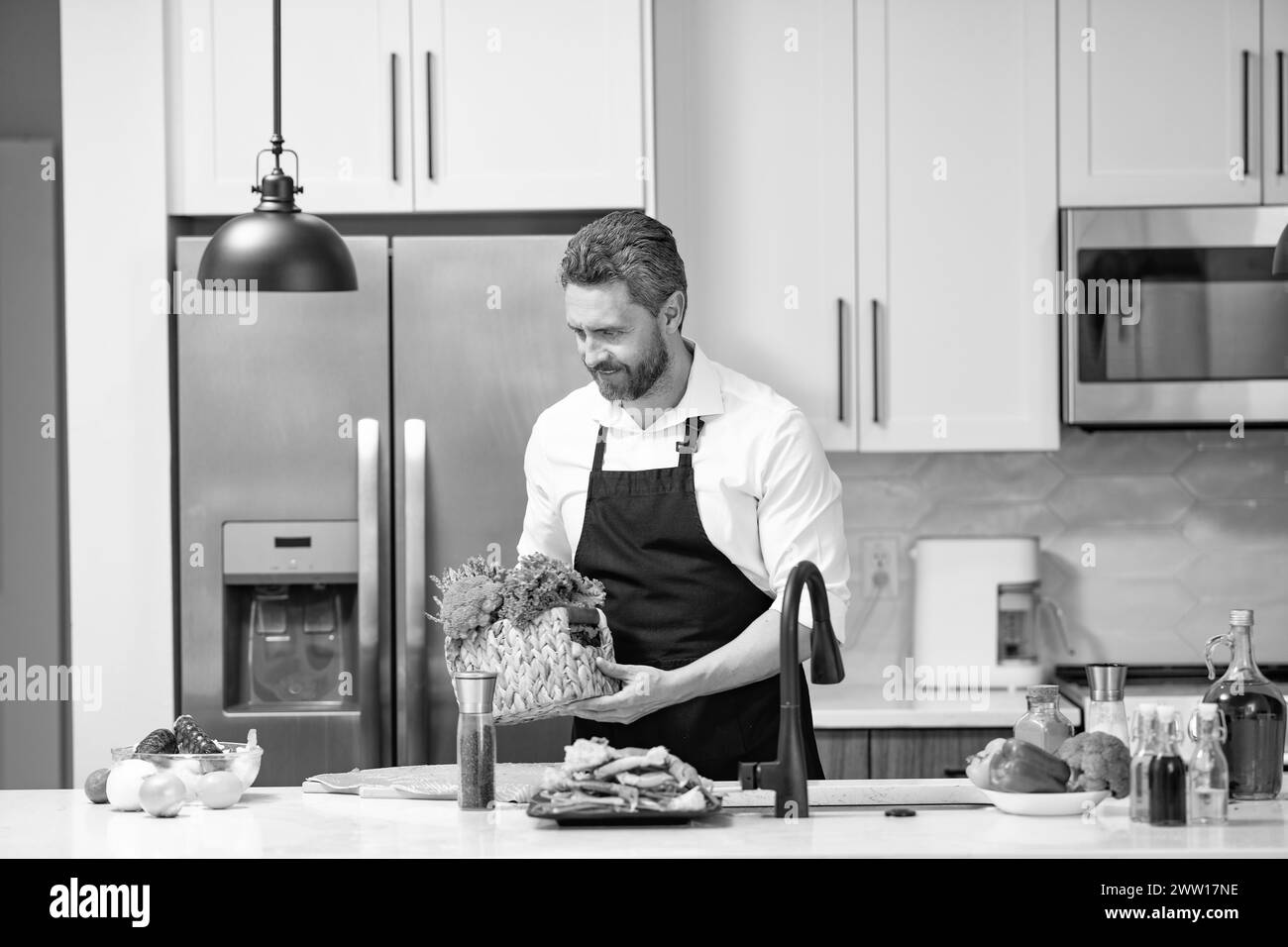 photo of man cooking healthy food. man cooking healthy food. man ...
