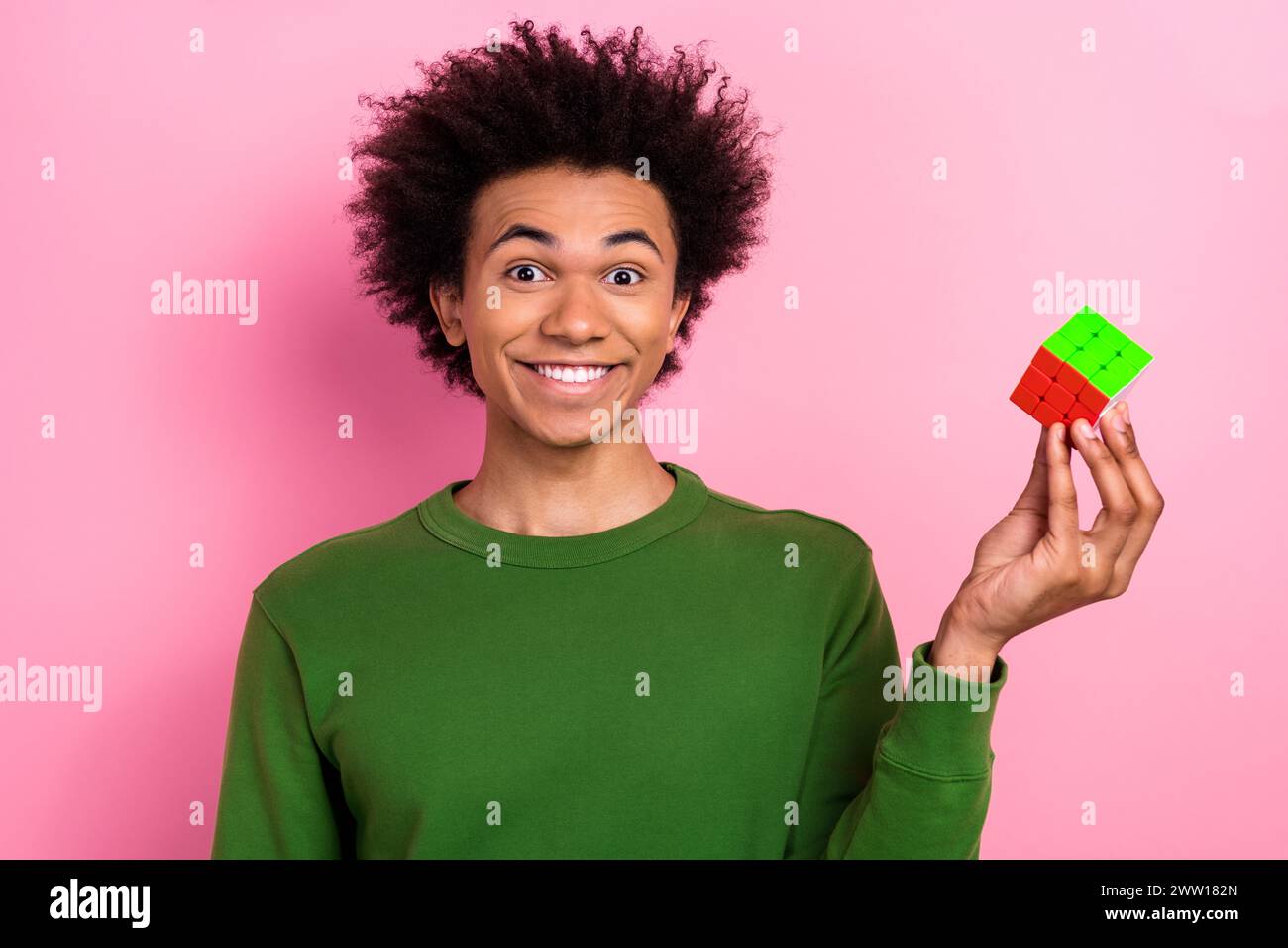 Photo of happy positive guy hold showing solved rubik cube isolated ... Photo of happy positive guy hold showing solved rubik cube isolated ...