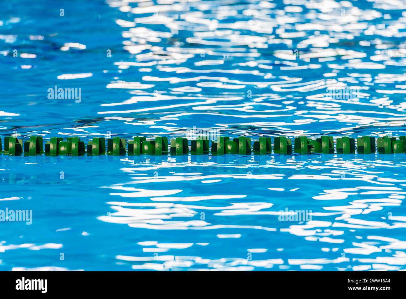 The view of an empty public swimming pool indoors. Lanes of a ...
