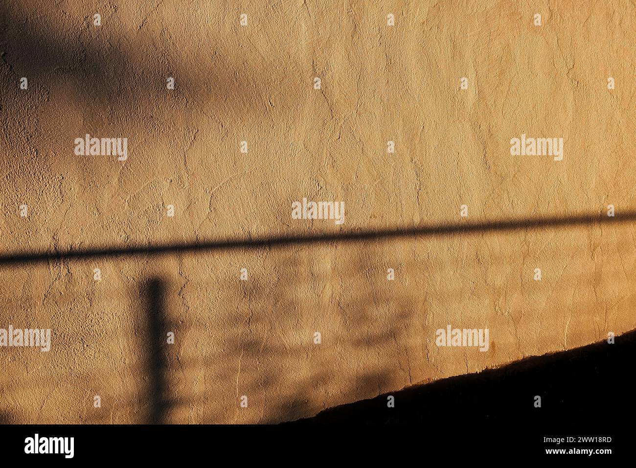 Ochre Wall Texture in Evening Light: Dark Shadows Cast an Enchanting ...