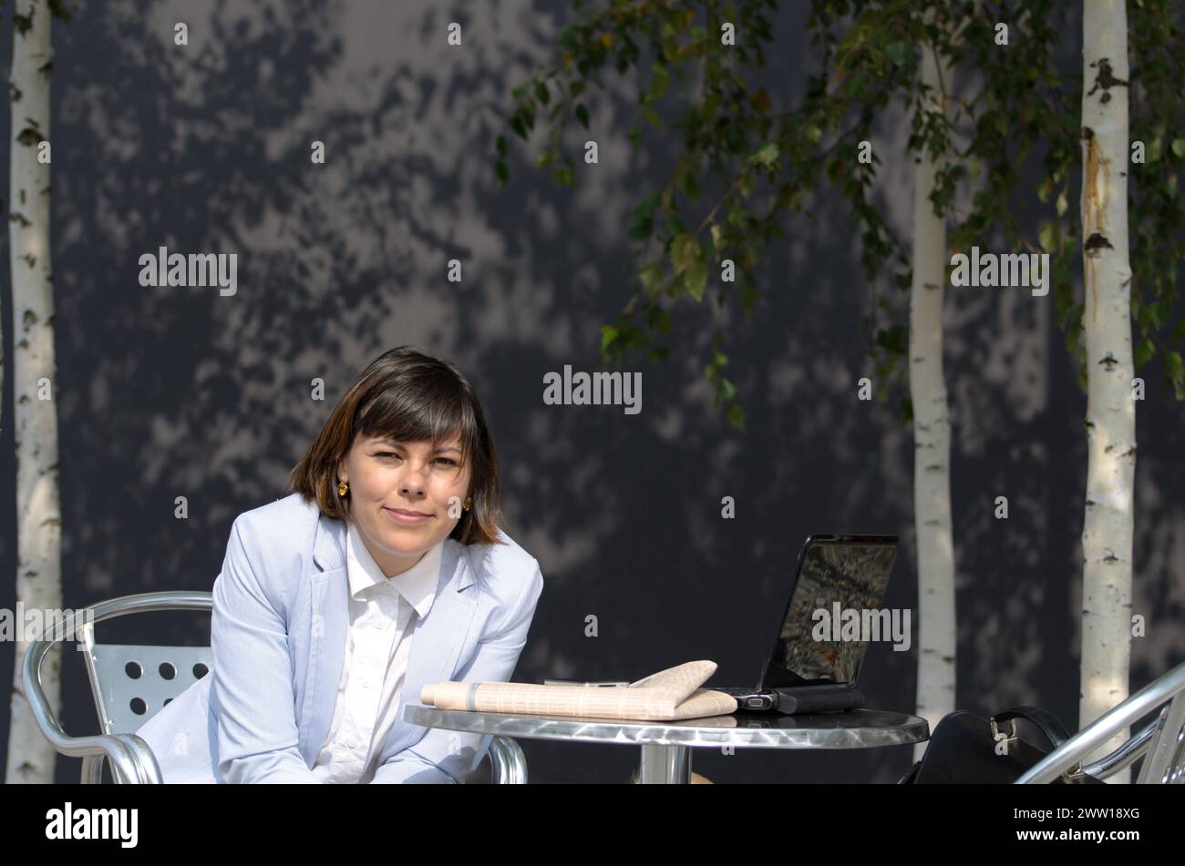 Business Woman Sitting with Her Personal Computer and Financial ...