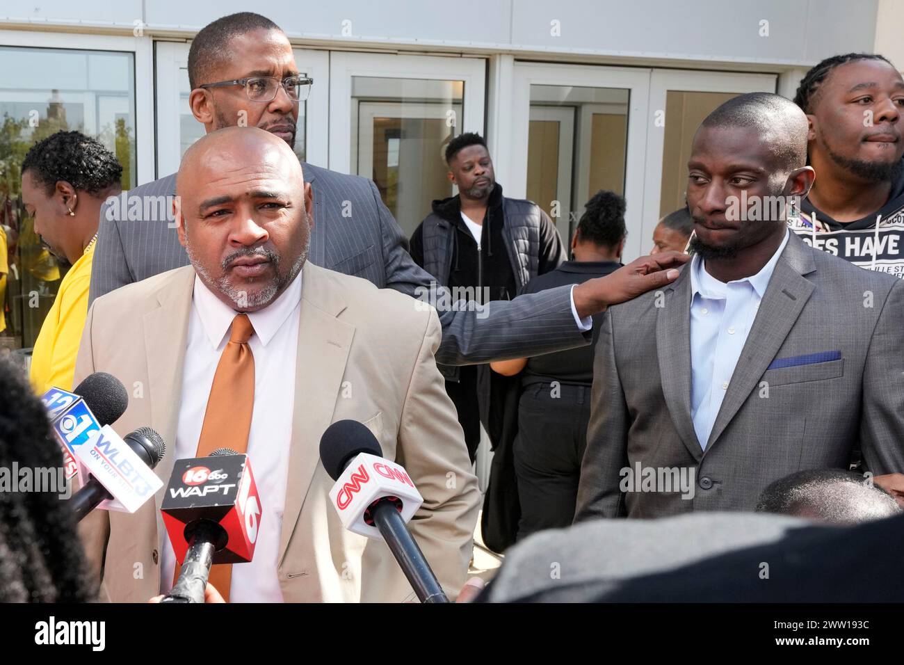 Civil co-counsel Malik Shabazz, left, speaks to reporters following the ...