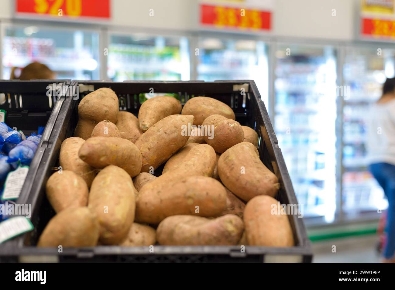 Sweet potato stand in a supermarket Stock Photo - Alamy