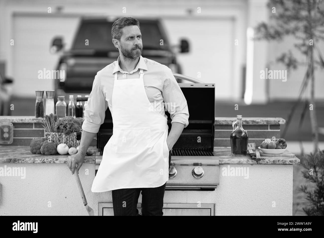 photo of cook man at bbq and grill in apron, banner. cook man at bbq ...