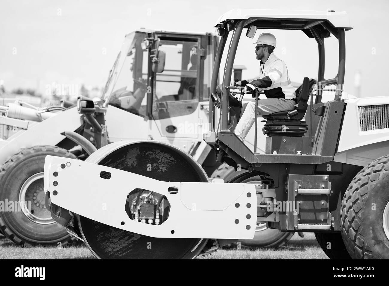 Man compactor Black and White Stock Photos & Images - Alamy