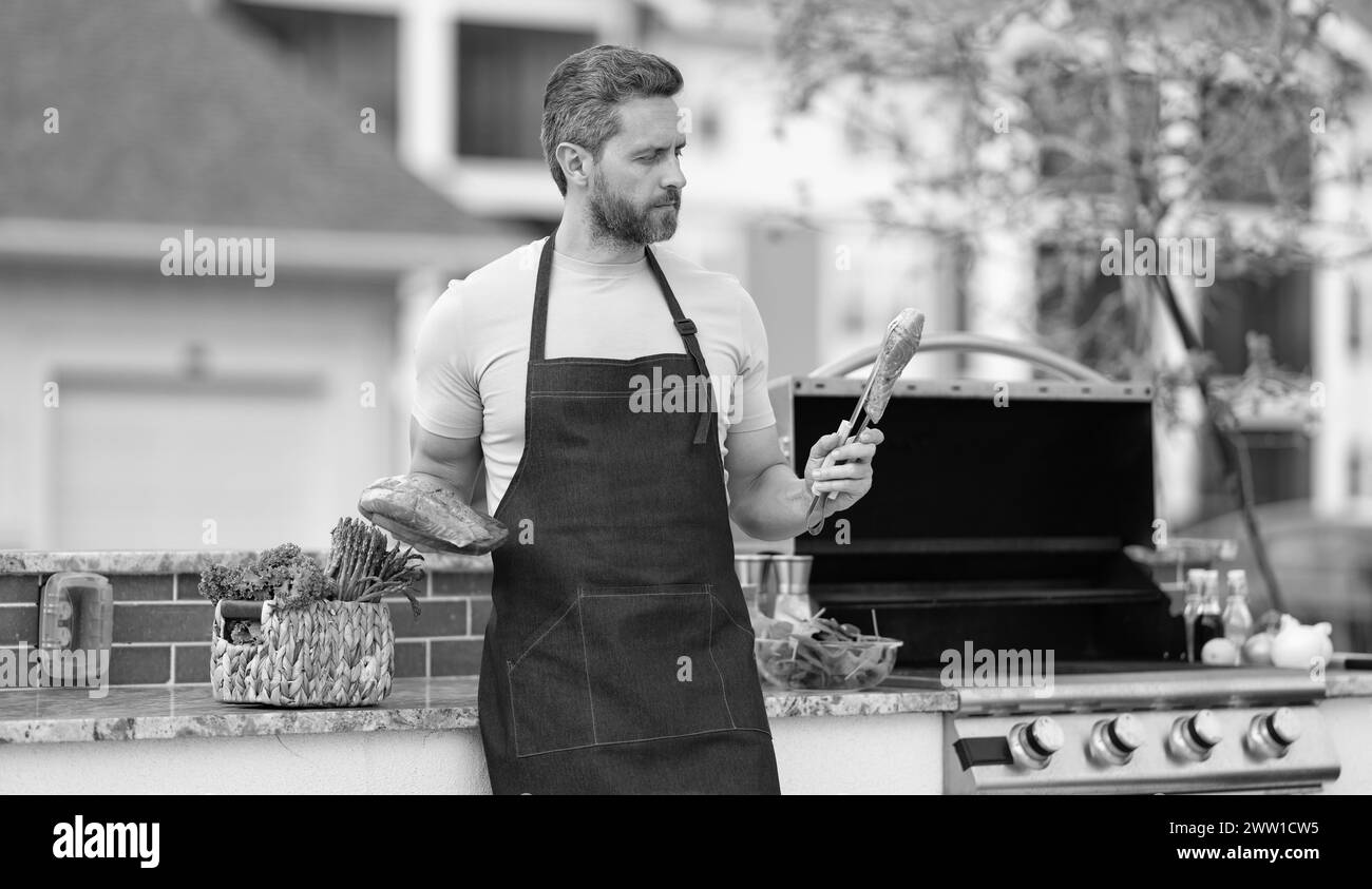 chef with grilled salmon. chef man cooking grilled salmon outdoor ...