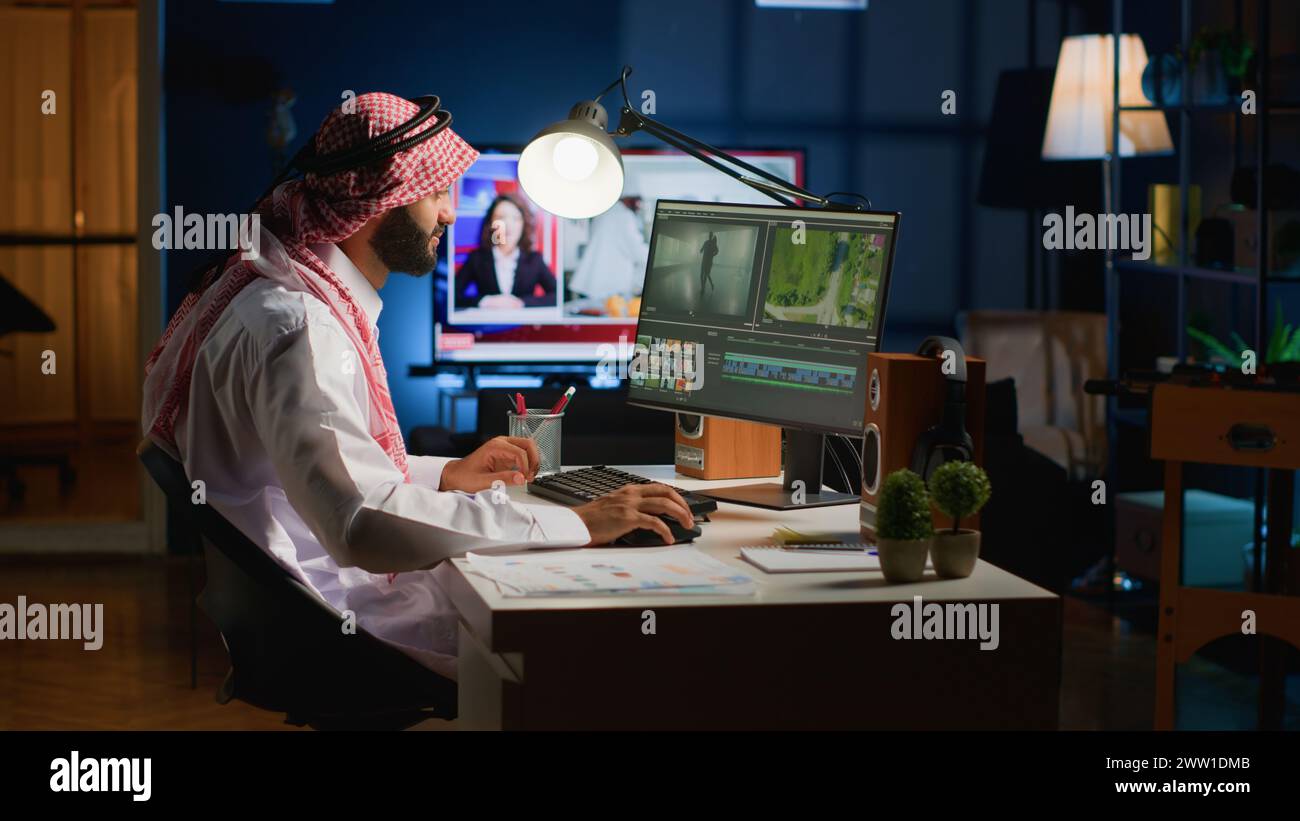 Cinematographer in home office doing post production on upcoming movie ...