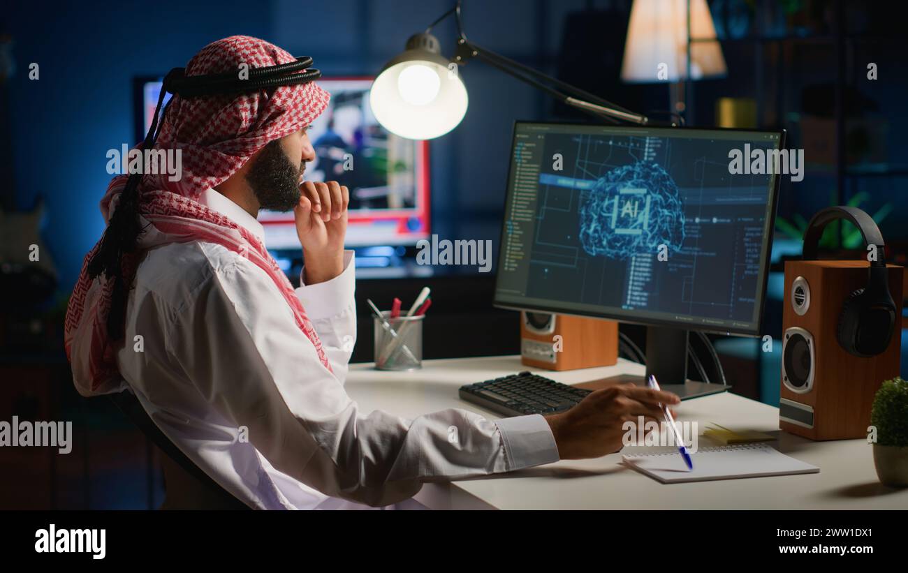 Man In Home Office Typing On Keyboard Updating Artificial Intelligence Neural Networks Writing