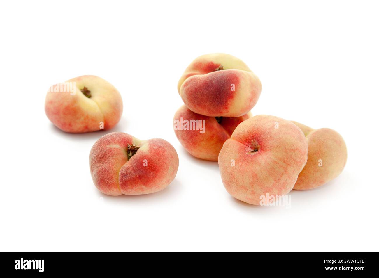 Several ripe chinese flat peach fruits or saturn peaches with soft ...