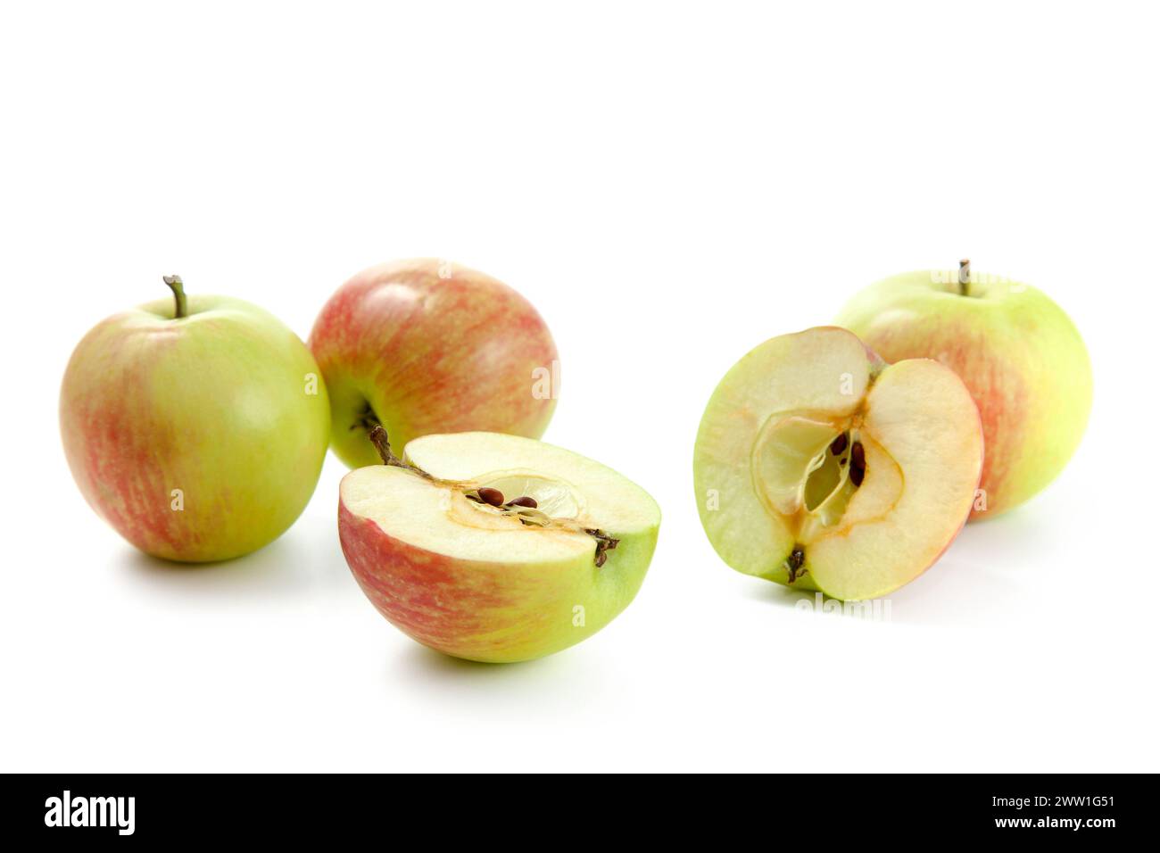 Half and whole of fresh green apples isolated on white background with ...