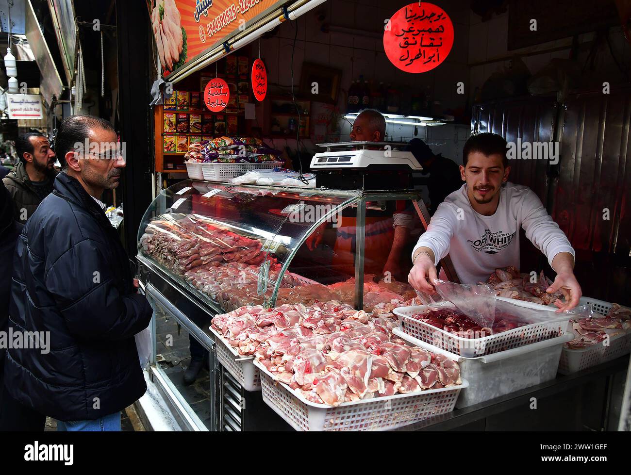 Damascus, Syria. 20th Mar, 2024. A man sells meat at a market during ...