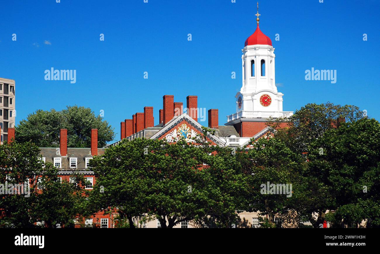 The red roof of the copula of the Dunster House rises on the campus of ...