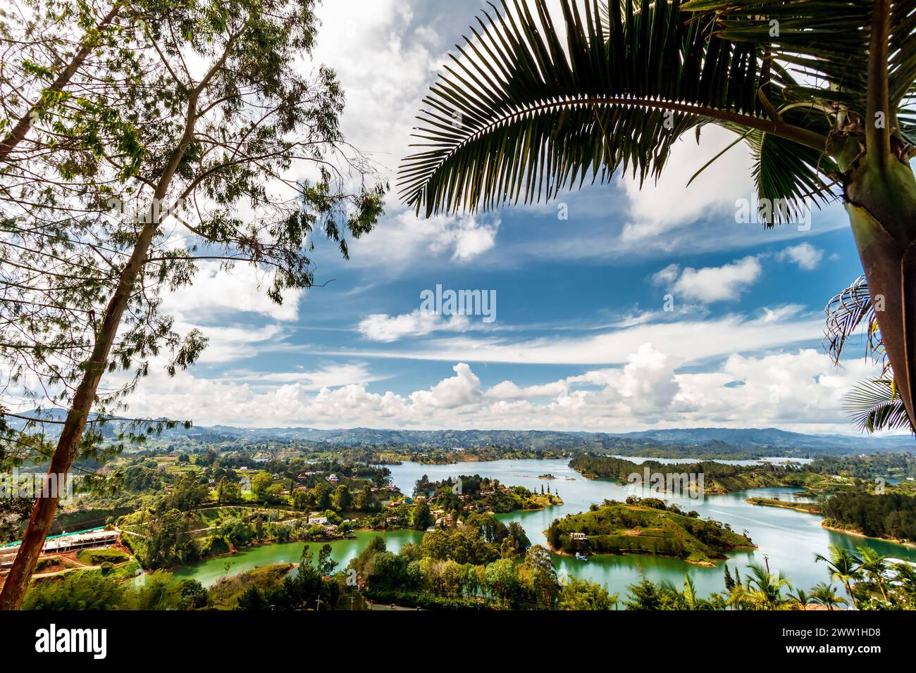 Panoramic view between trees of the Peñol-Guatape reservoir in ...