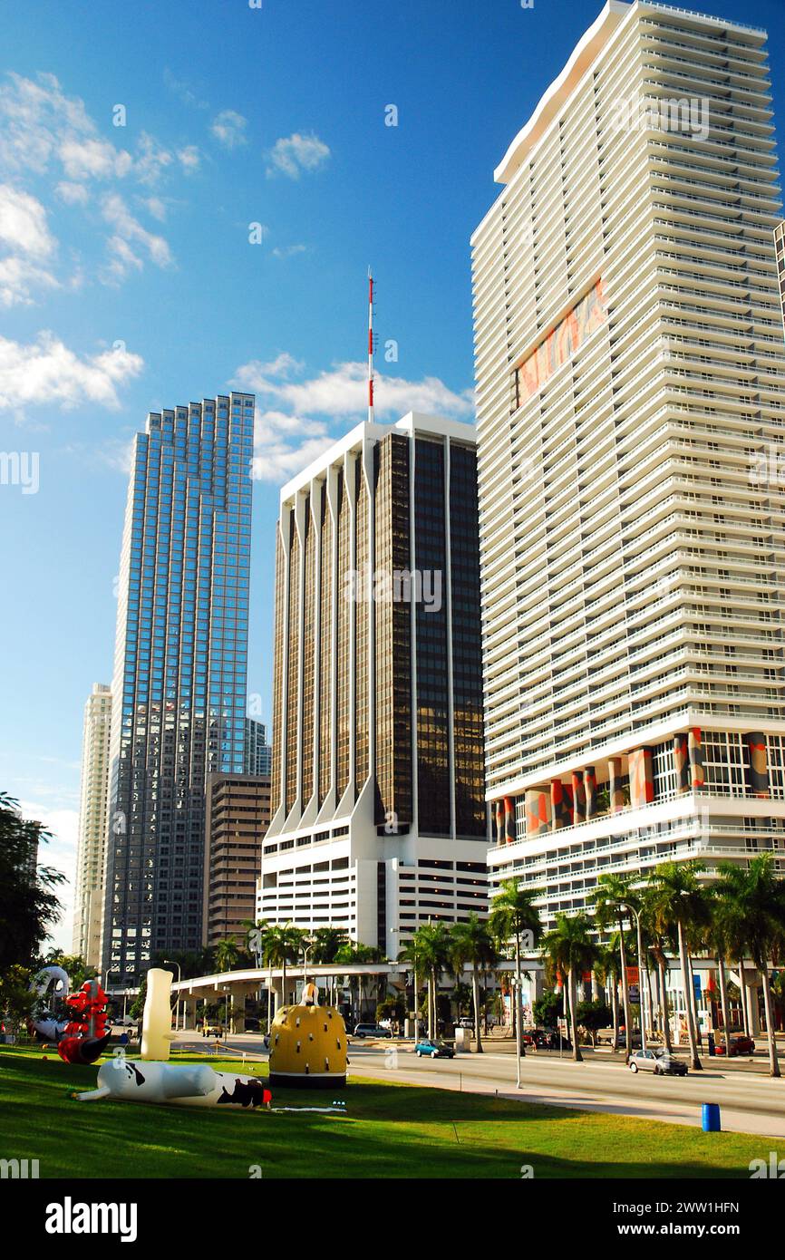 The office buildings of Downtown Miami rise along the street near the ...