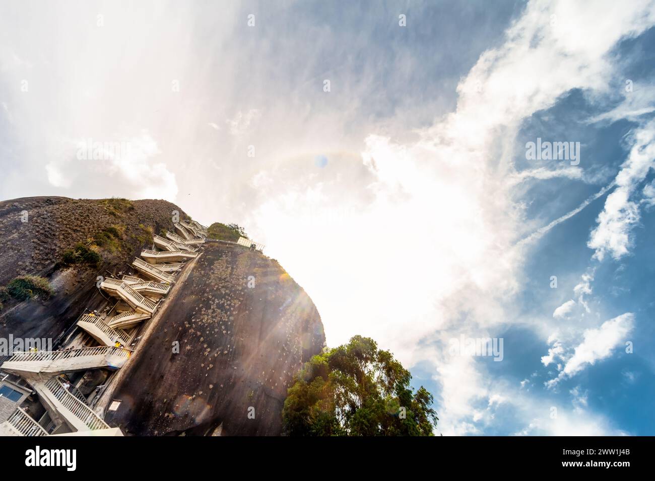View from below against sunlight of the Rock of Guatape, Colombia Stock ...