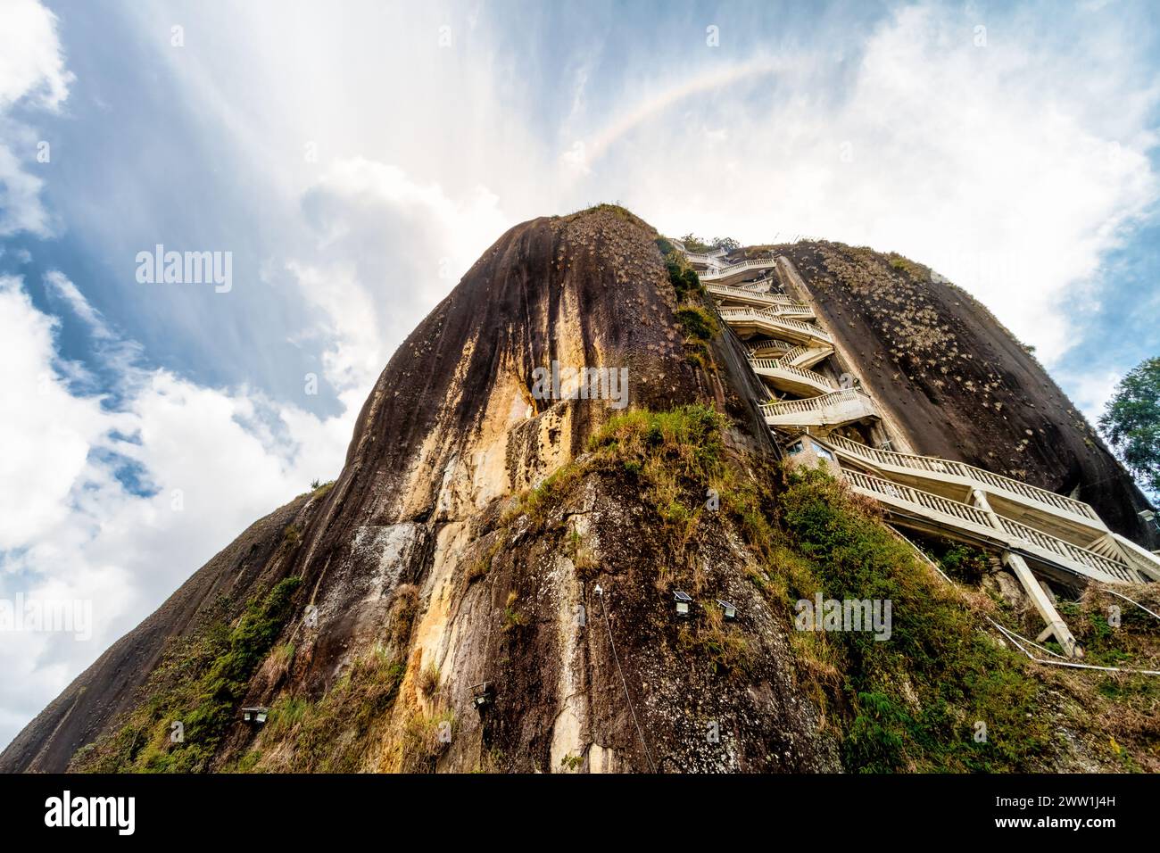 View from below against sunlight of the Rock of Guatape, Colombia Stock ...