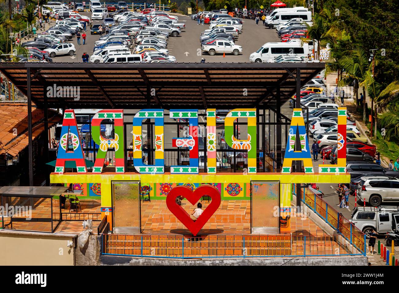 Guatape, Colombia - January 16, 2023: Woman tourist poses for a photo ...