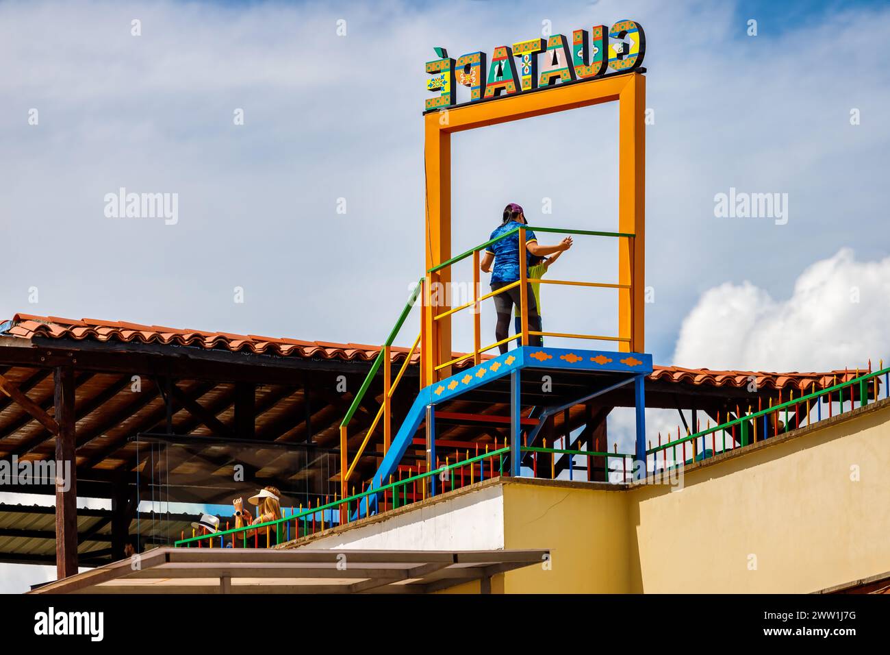 Guatape, Colombia - January 16, 2023: Woman tourist poses for a photo ...
