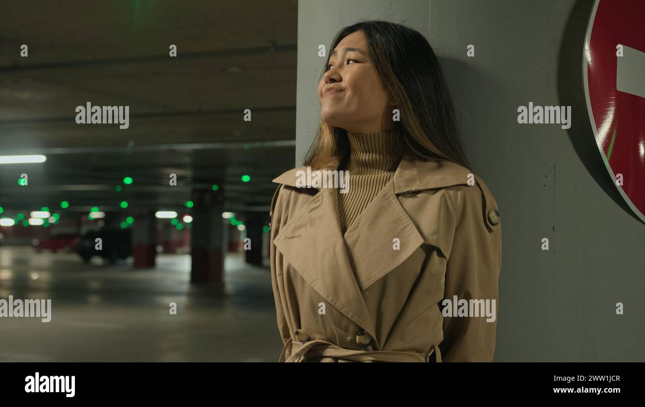 Frightened Asian ethnic chinese korean woman hiding from danger pursuit ...