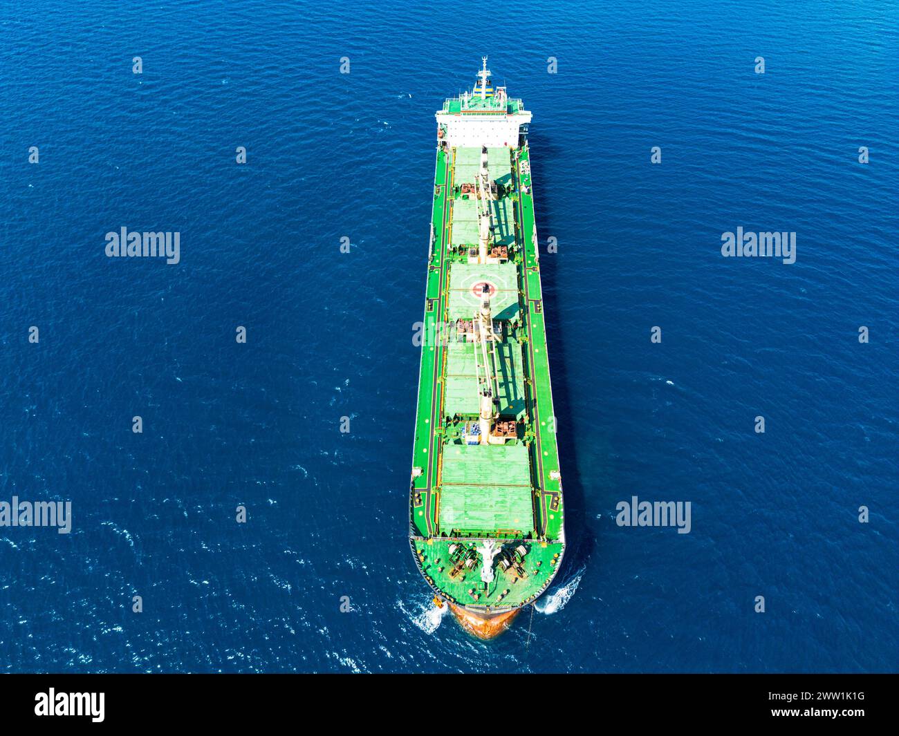 Aerial photo of huge bulk carrier tanker anchored in deep blue Aegean ...