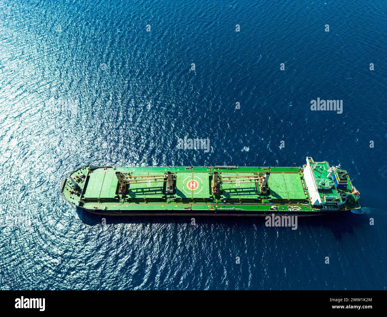 Aerial photo of huge bulk carrier tanker anchored in deep blue Aegean ...