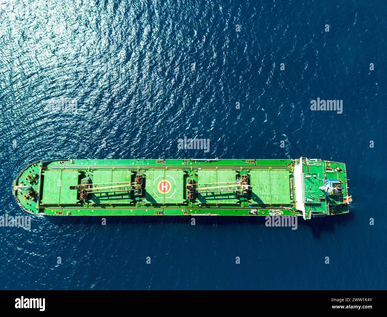 Aerial photo of huge bulk carrier tanker anchored in deep blue Aegean ...