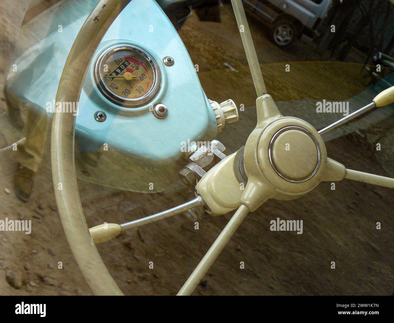 Interior of a BMW Isetta 300 steering wheel and speedometer through its ...