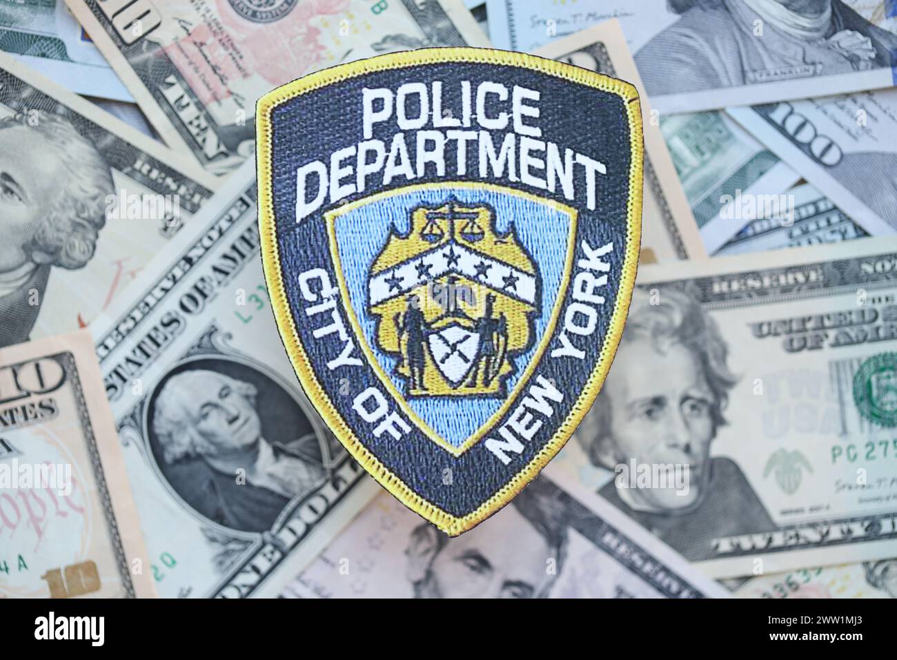 KYIV, UKRAINE - MARCH 9, 2024 US NYPD Police patch on many US dollar ...