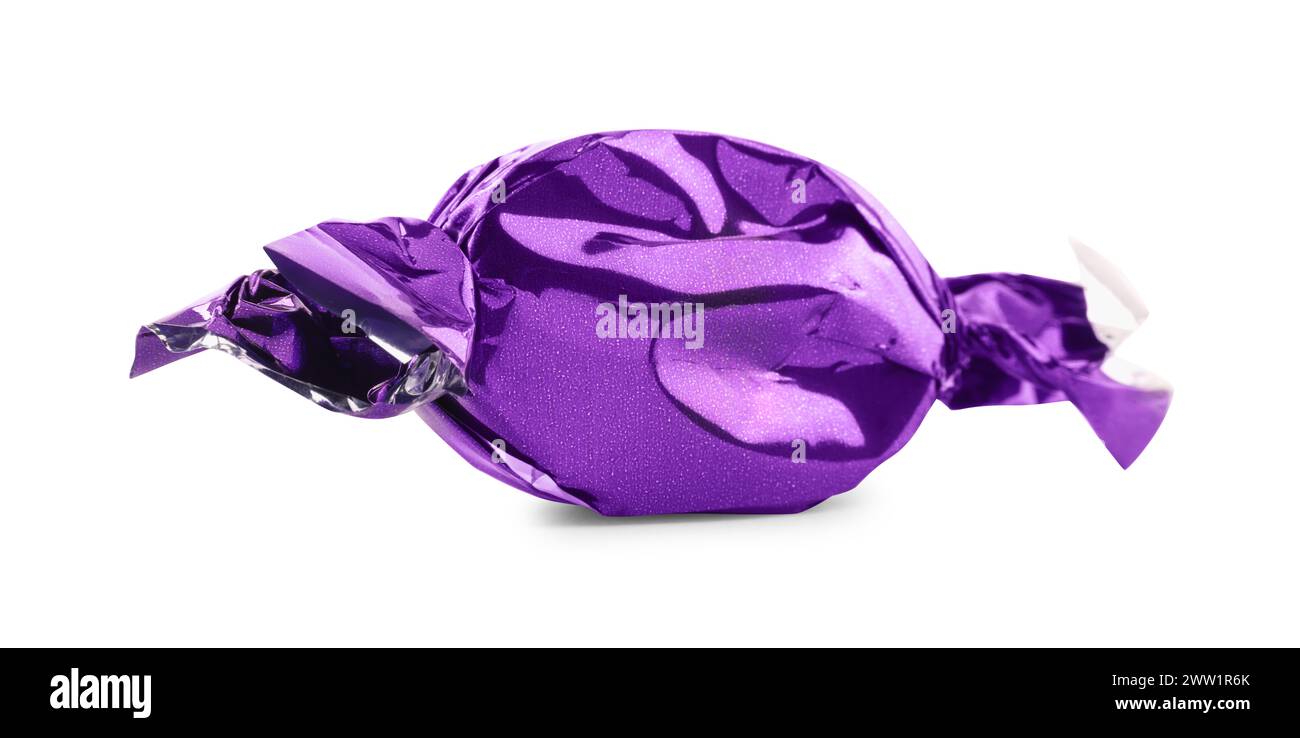 Candy in purple wrapper isolated on white Stock Photo - Alamy