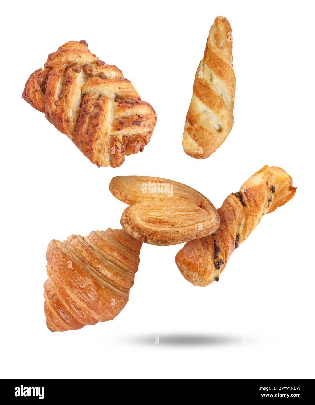 Different tasty puff pastries falling on white background Stock Photo ...