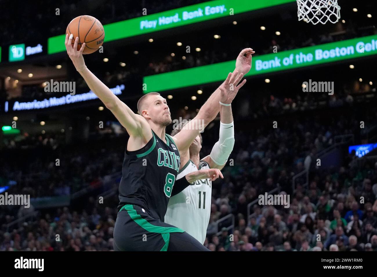 Boston Celtics center Kristaps Porzingis (8) shoots next to Milwaukee ...