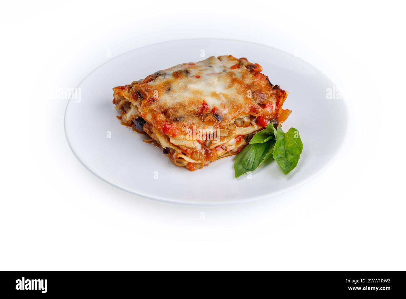 slice of lasagna with melted cheese on top and minced meat filling ...