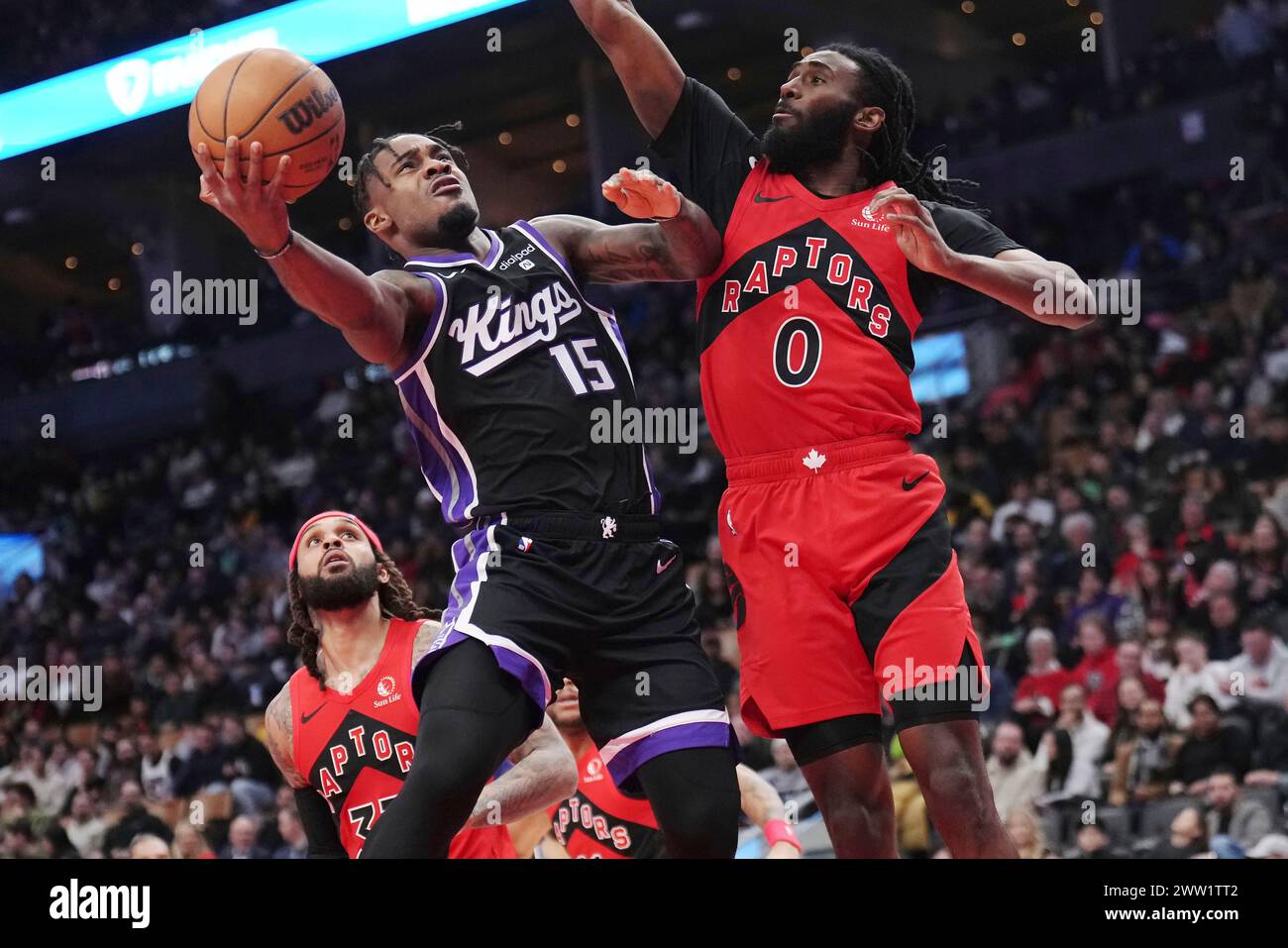 Sacramento Kings guard Davion Mitchell (15) shoots as Toronto Raptors ...