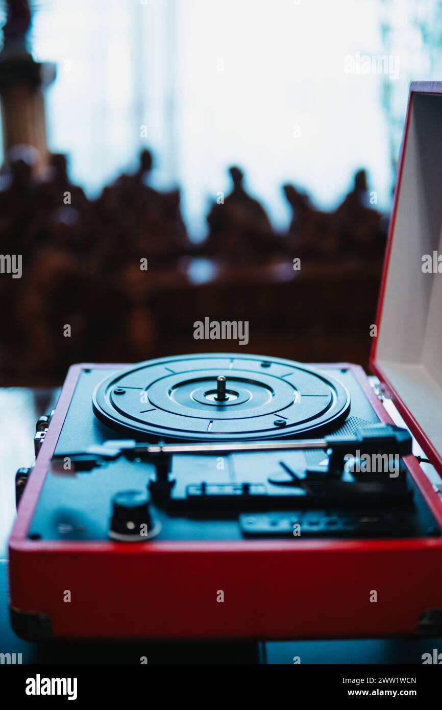 Red vintage-style portable record player with a focused foreground and ...