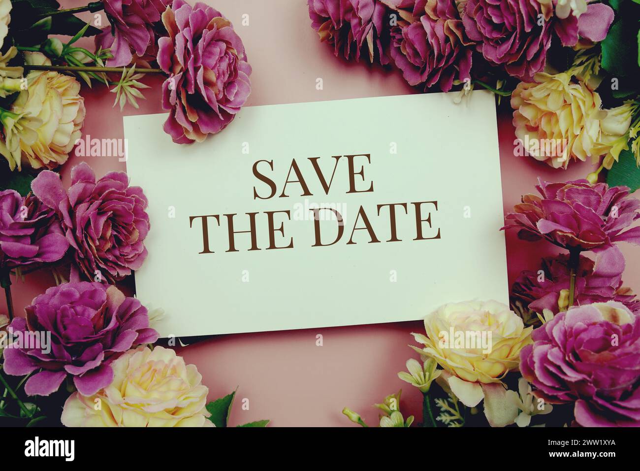 Save the Date typography text with flowers on pink background Stock ...