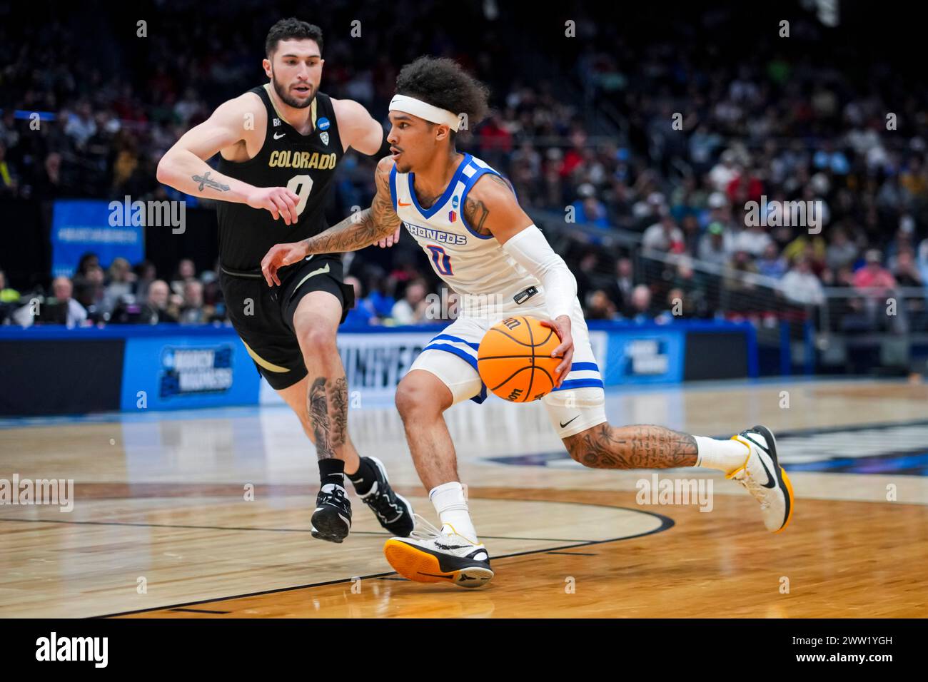 Boise State guard Roddie Anderson III, right, drives to the basket ...