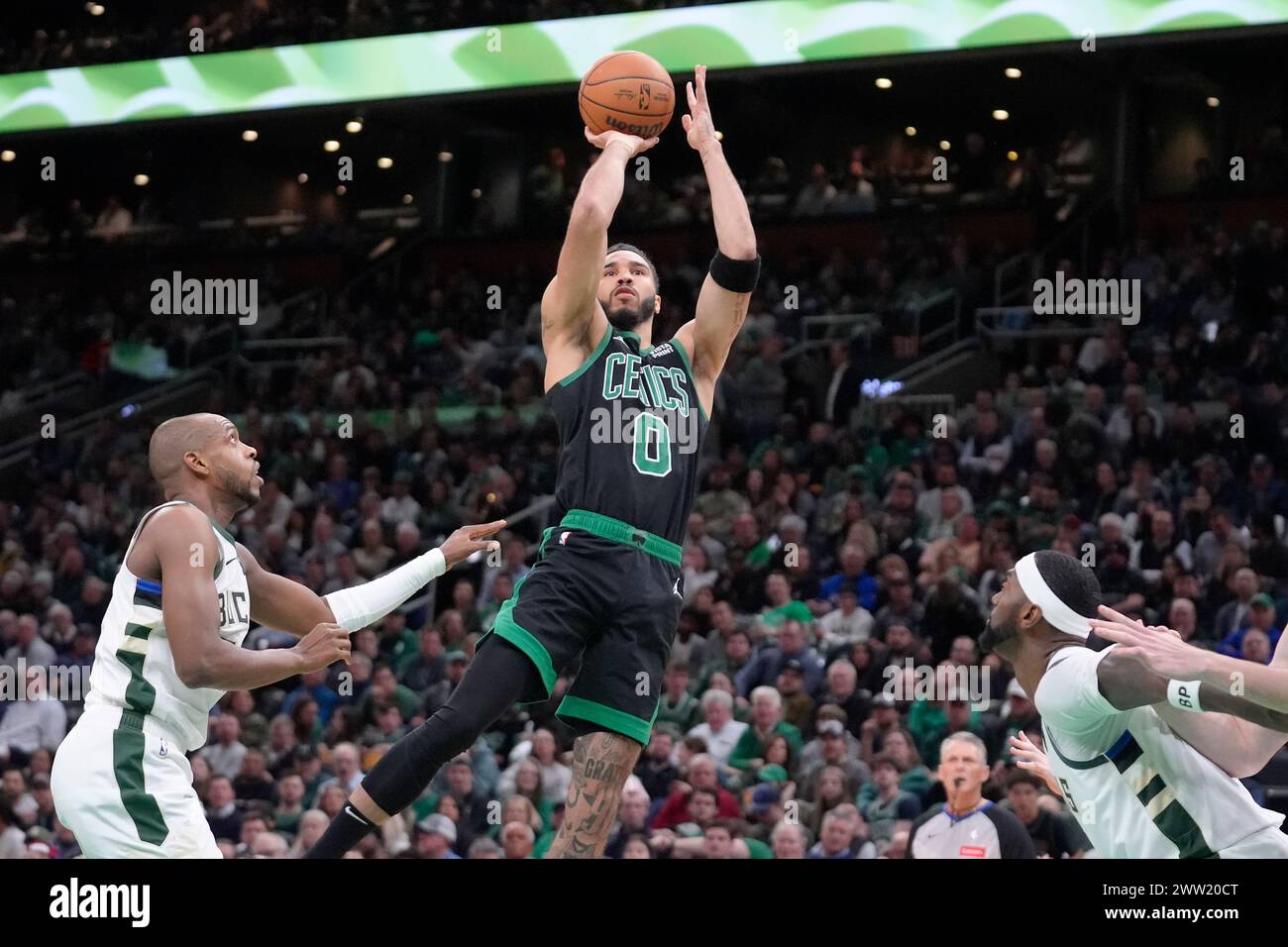 Boston Celtics forward Jayson Tatum (0) shoots in front of Milwaukee ...