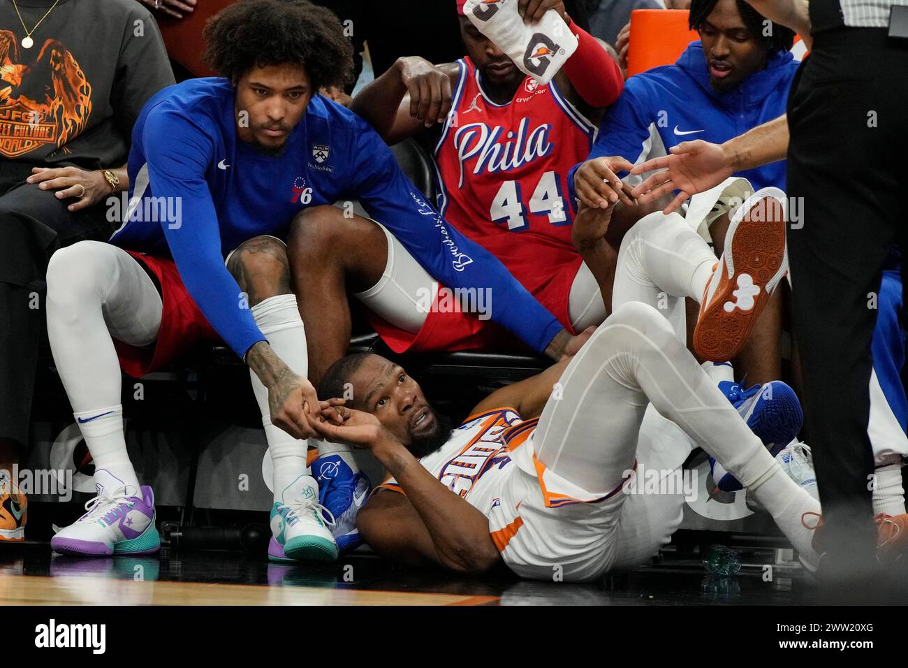 Phoenix Suns forward Kevin Durant falls into the Philadelphia 76ers ...