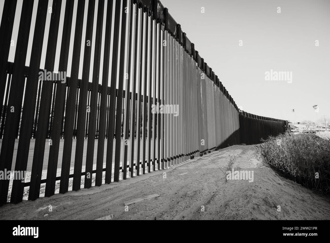 The US border wall between Yuma Arizona and Los Algodones Mexico. Black ...