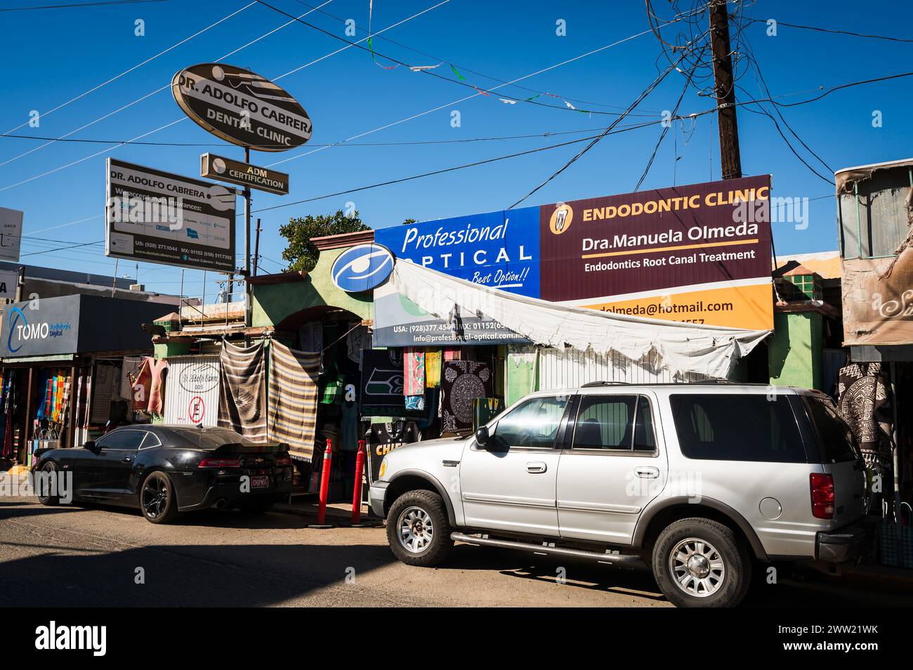 Dental offices, pharmacies, and opticians on the street at Los ...