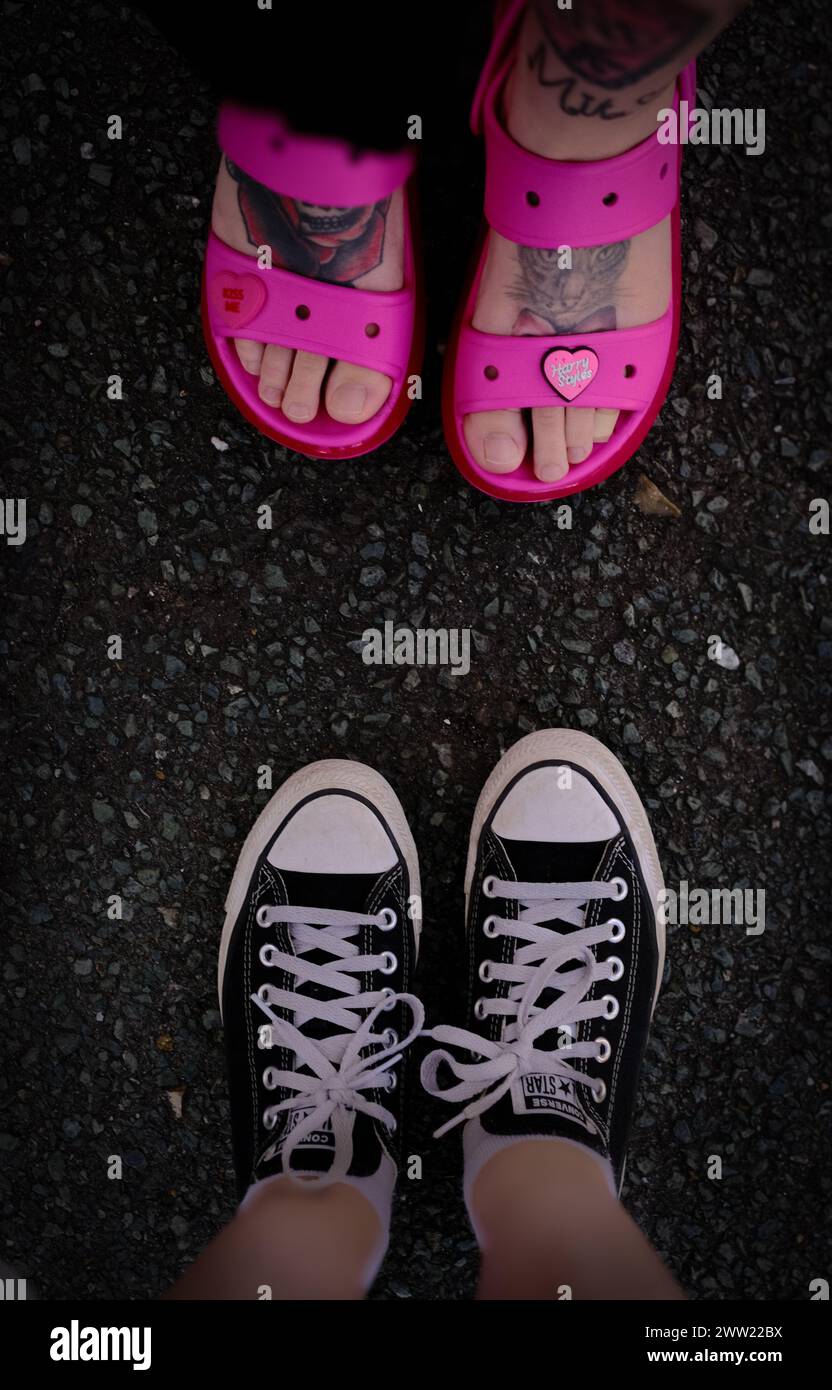 Pink croc mega crush sandals and converse Stock Photo - Alamy