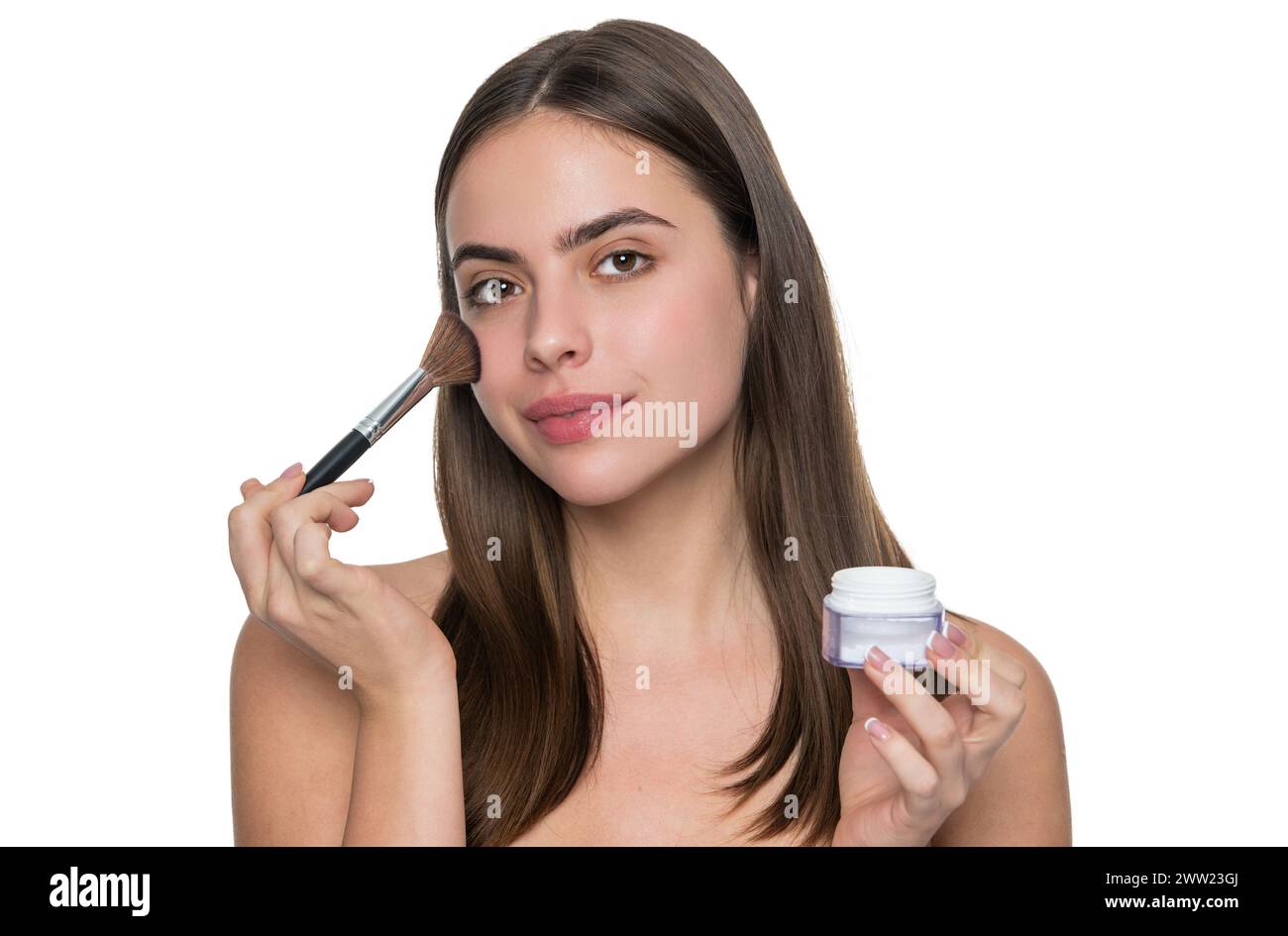 Girl applying blush with makeup brush. Beauty cosmetic product. Young ...