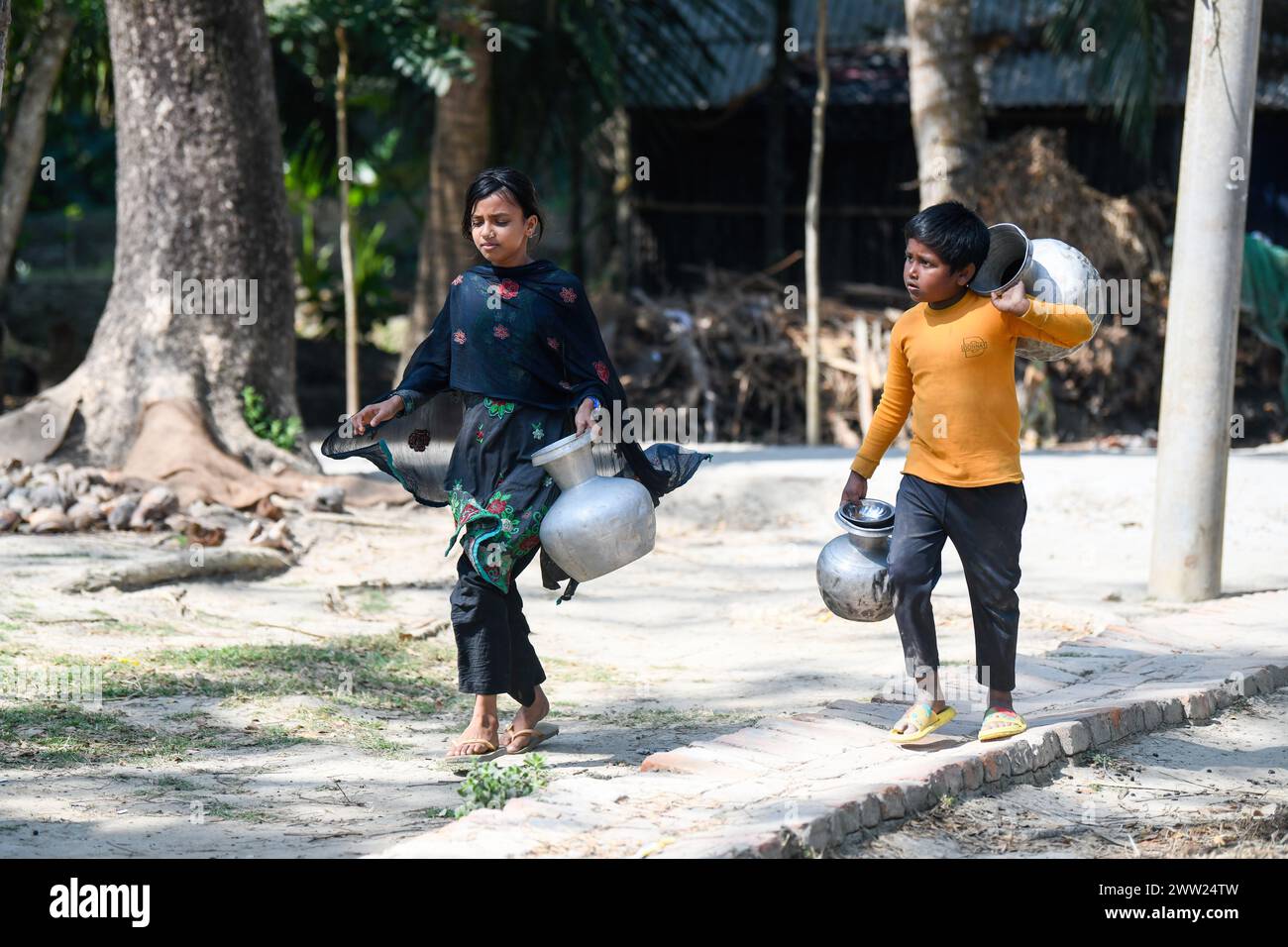Children are going to collect drinking water from a reverse-osmosis ...