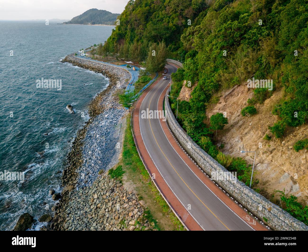 curved road alongside the ocean beach road of Thailand. road landscape ...