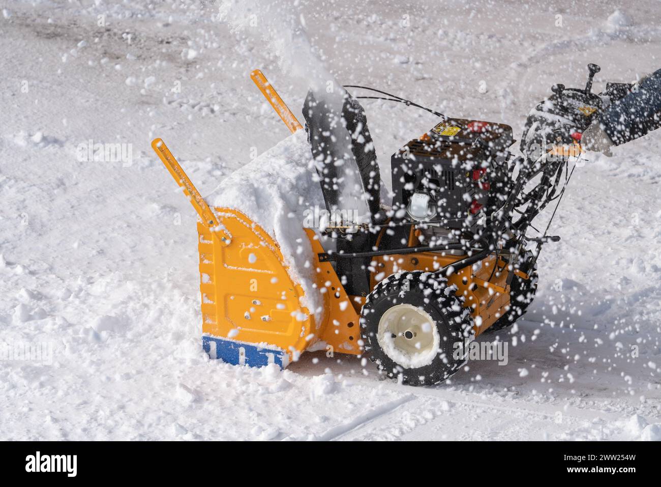 Snow blower machine is effectively removing snow from road after winter ...