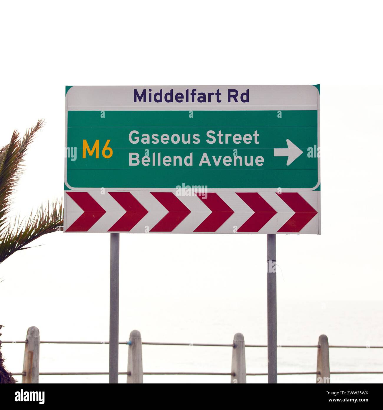 Road sign, intersection and direction in city with arrow for grammar ...