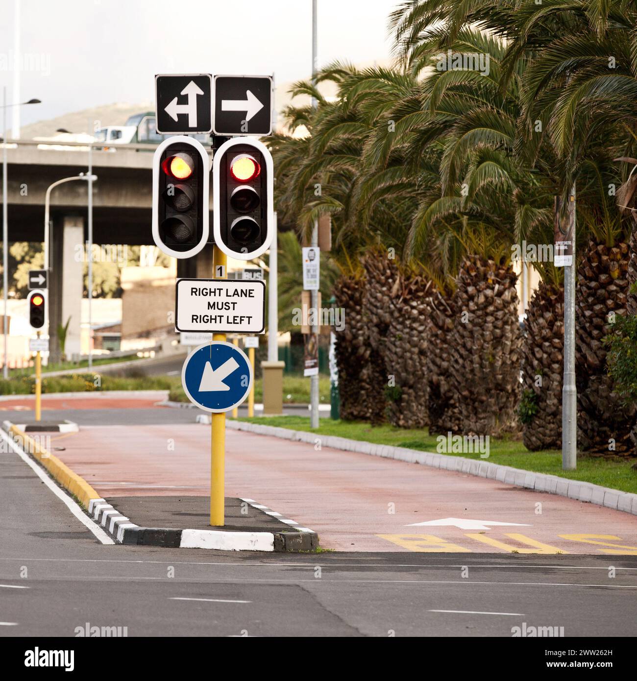 Street, traffic light and sign with arrow in city with mistake for ...