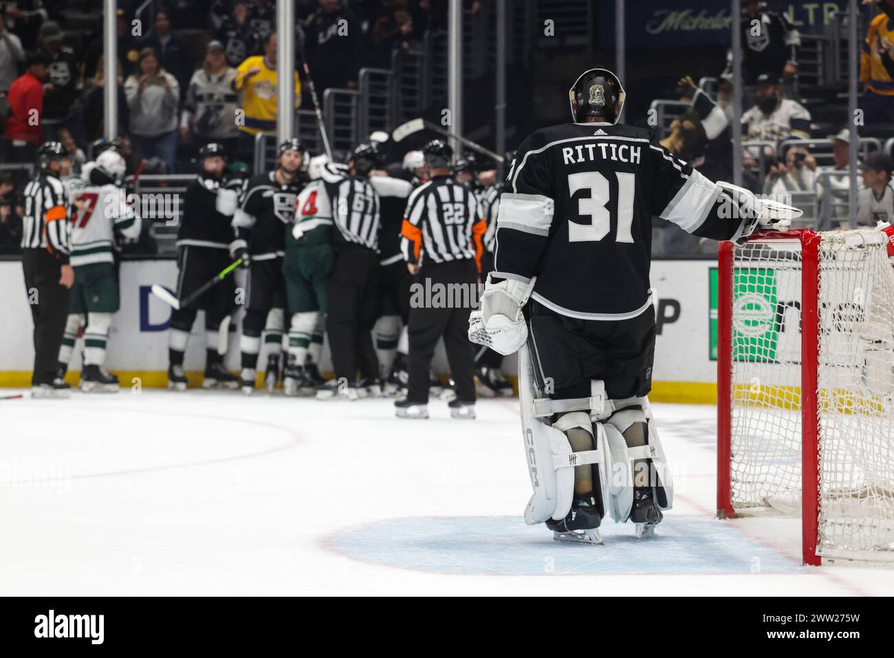 Los Angeles Kings goalie David Rittich (31) watches as players from the ...