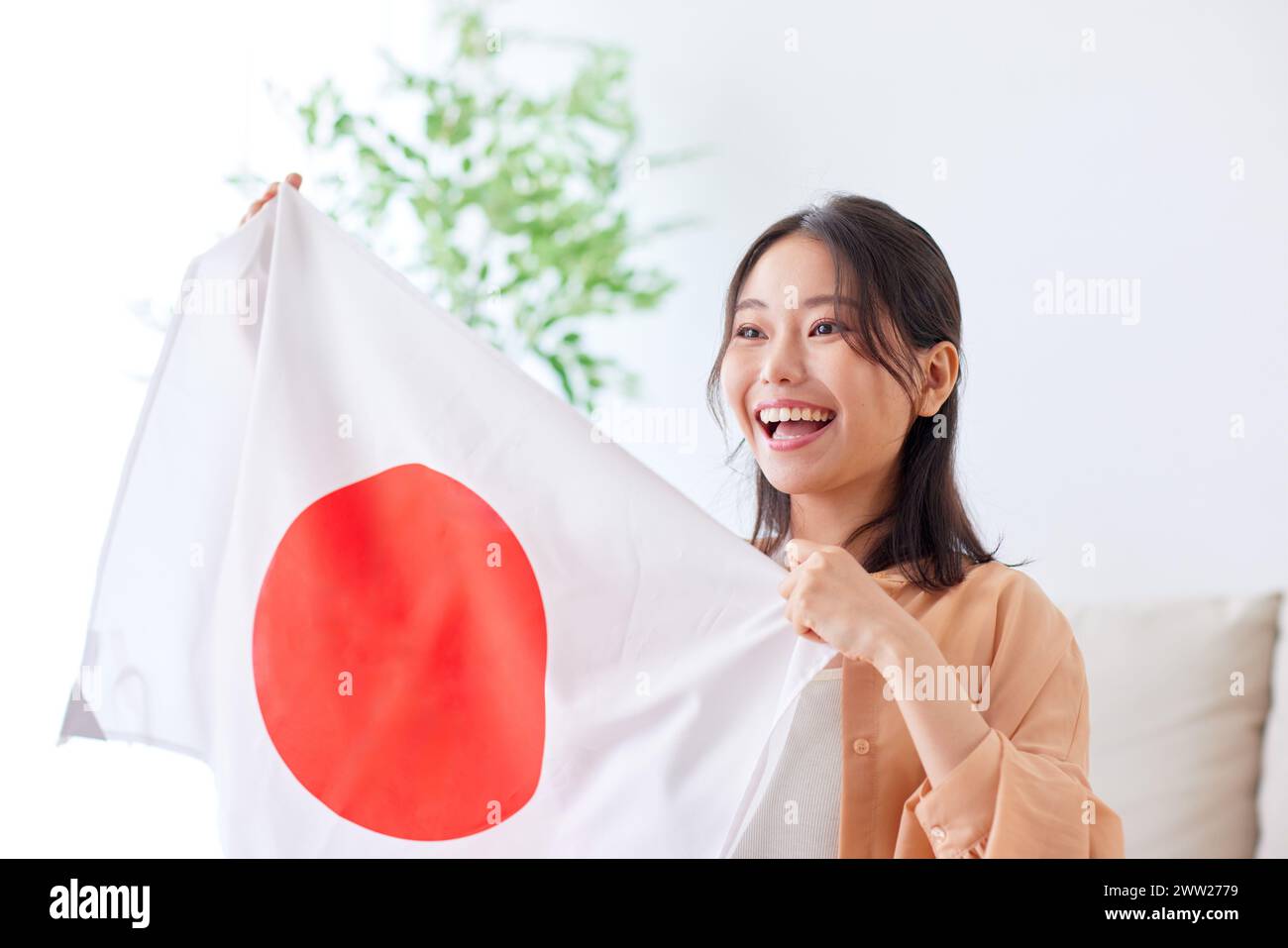Holding japanese flag hi-res stock photography and images - Alamy
